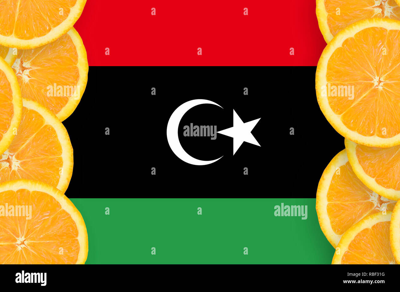 Libya flag in vertical frame of orange citrus fruit slices. Concept of ...