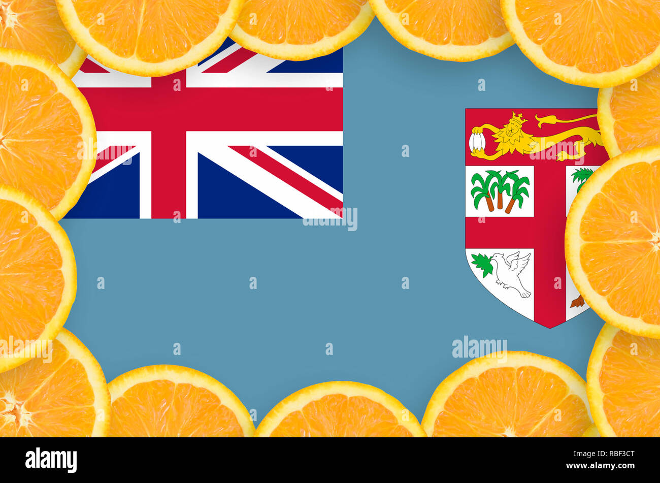 Fiji flag in frame of orange citrus fruit slices. Concept of growing as ...
