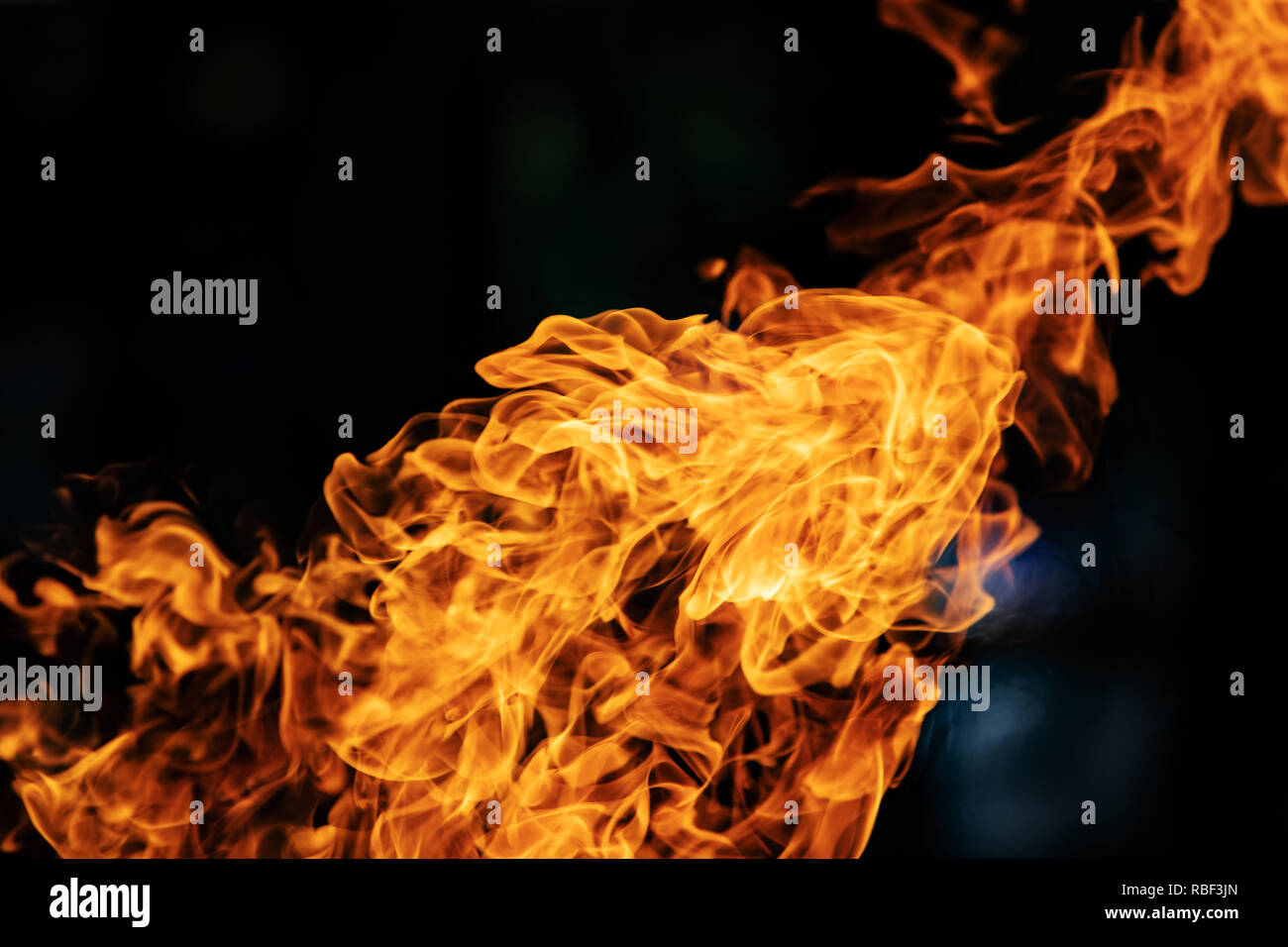 Closeup Fire flames on black background Stock Photo - Alamy