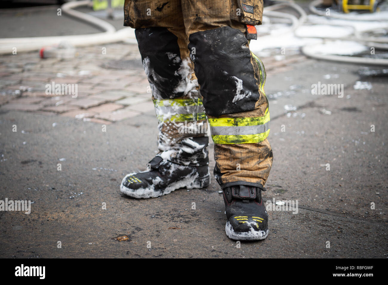 10 January 2019, Berlin: A firefighter is standing in front of an ...