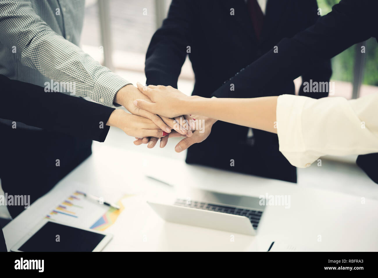 Close up top view of young business people putting their hands together. Stack of hands. Unity ...