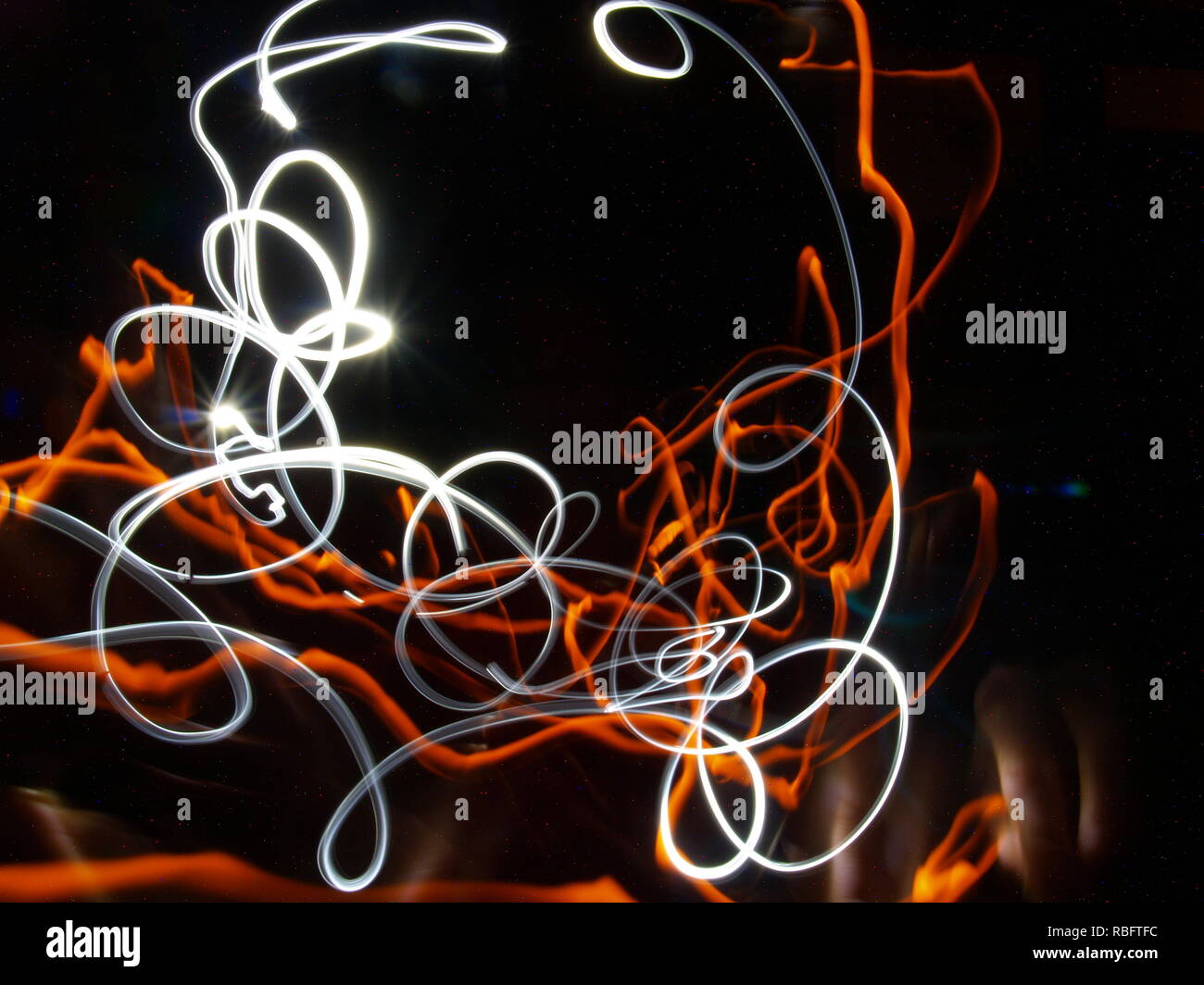 Double light trails with fire and torch Stock Photo - Alamy