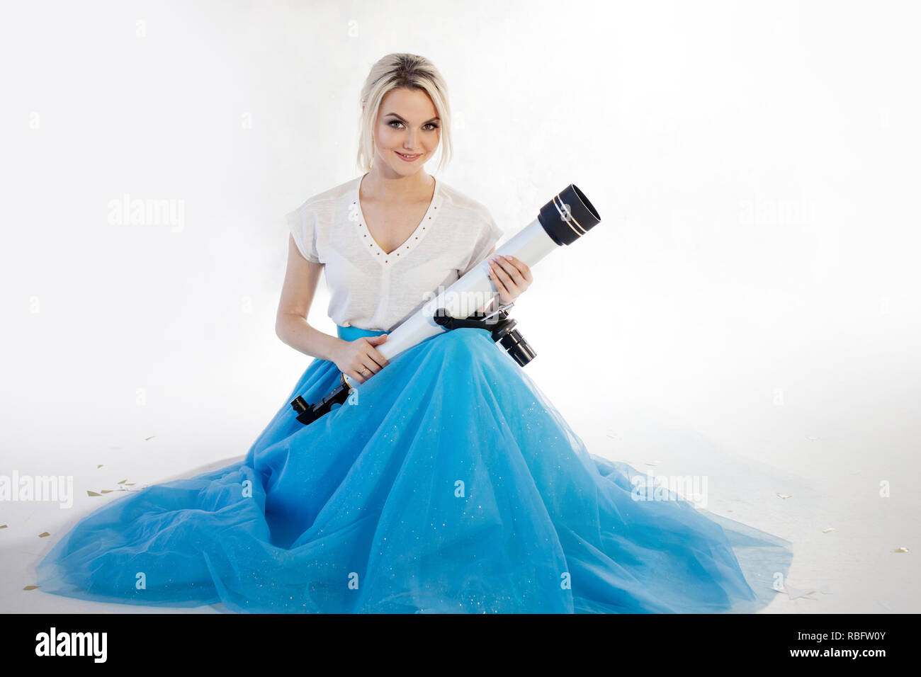 Young woman dreams of the future, concept. Girl looks up and uses a ...