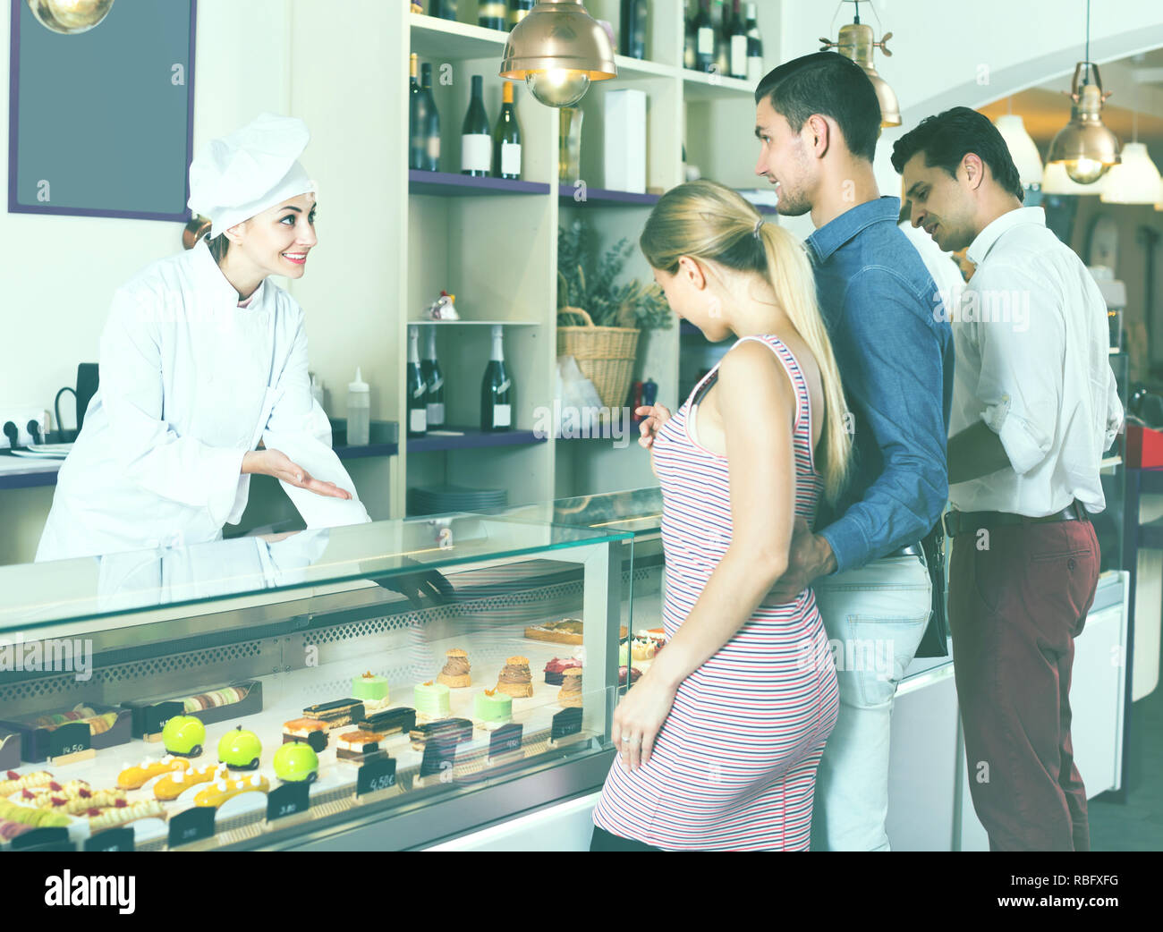 Confectioner serving client hi-res stock photography and images - Alamy