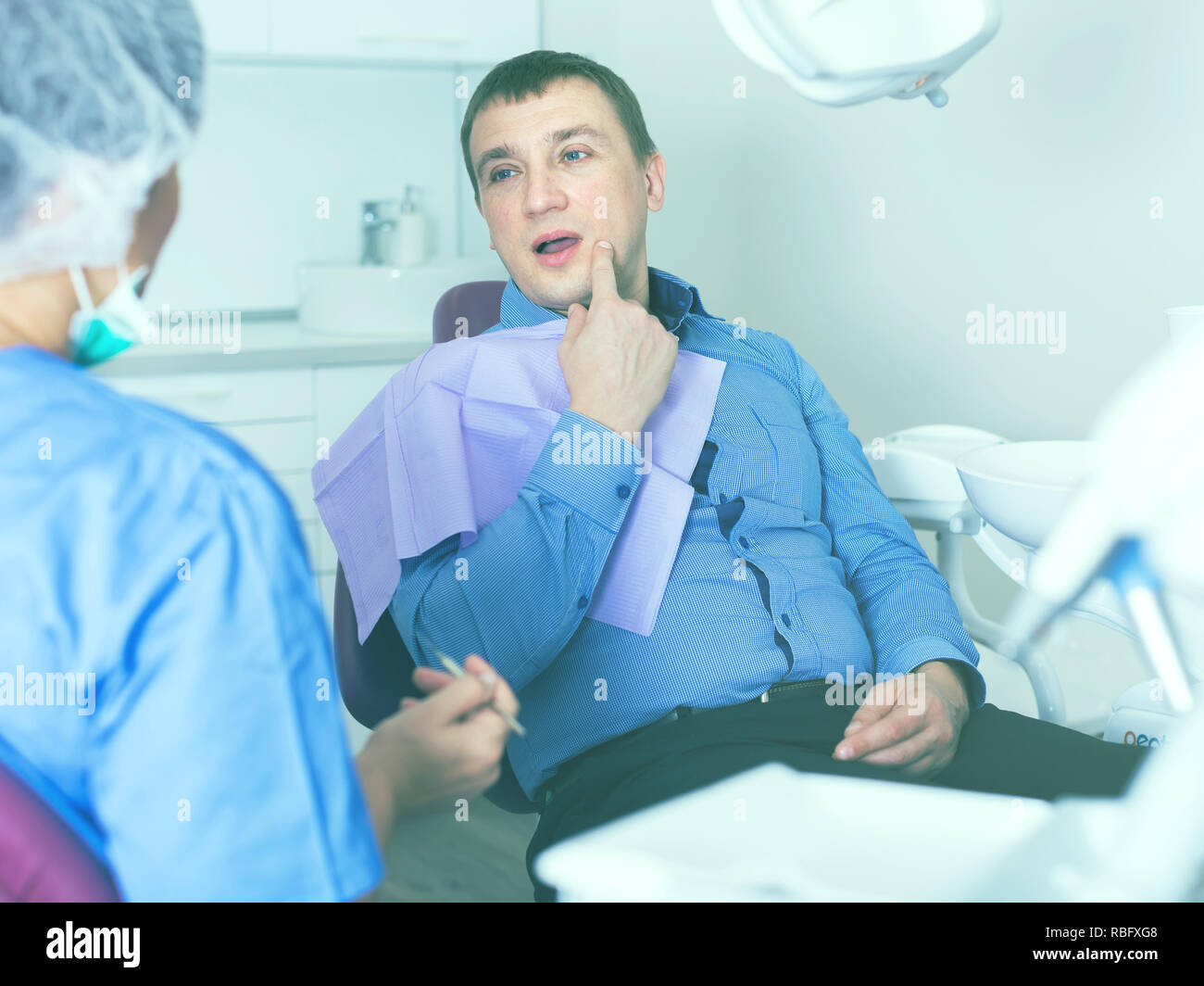 professional positive doctor woman talking with patient in medical ...