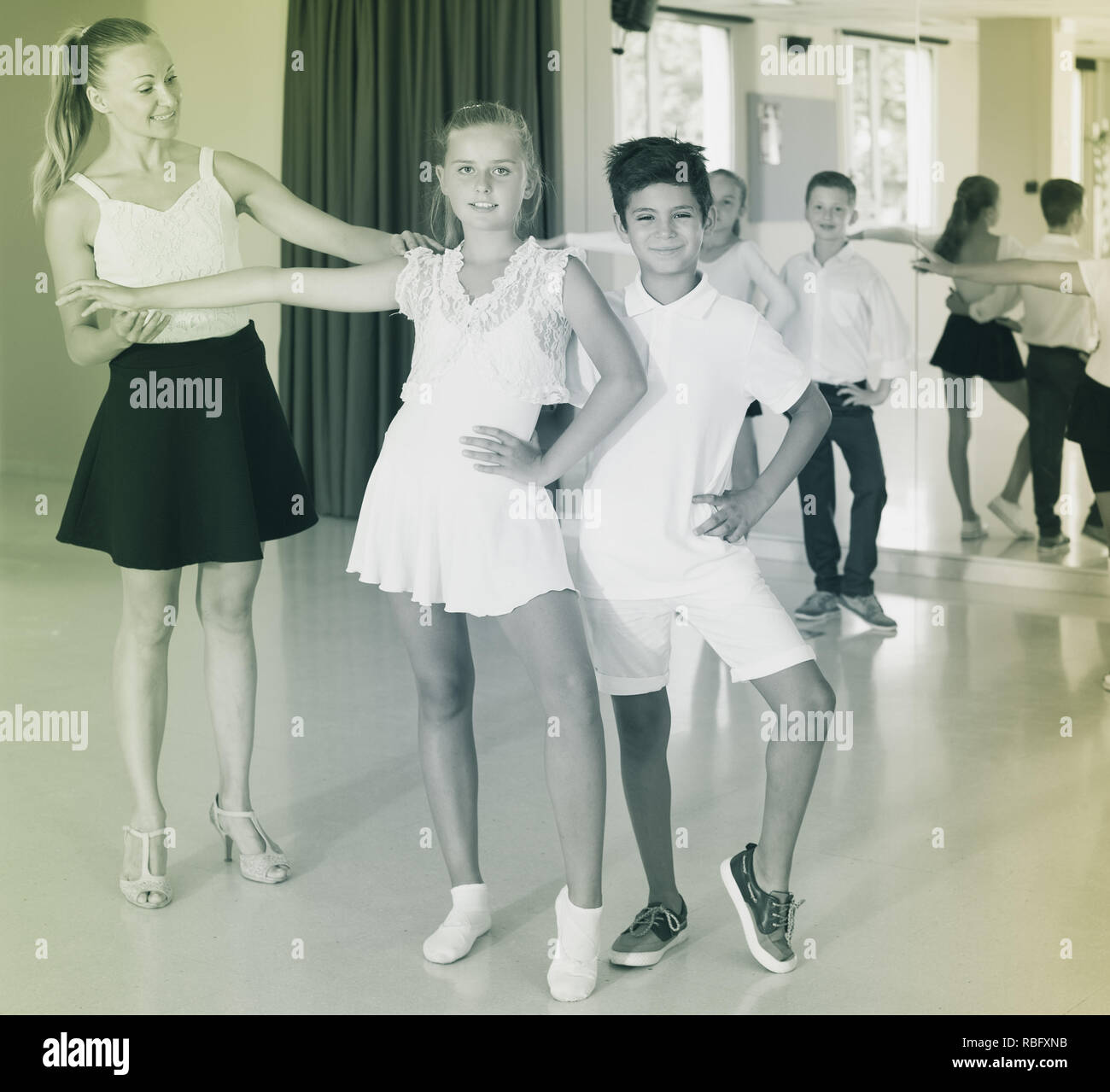 Active happy young children enjoying of partner dance in class Stock ...
