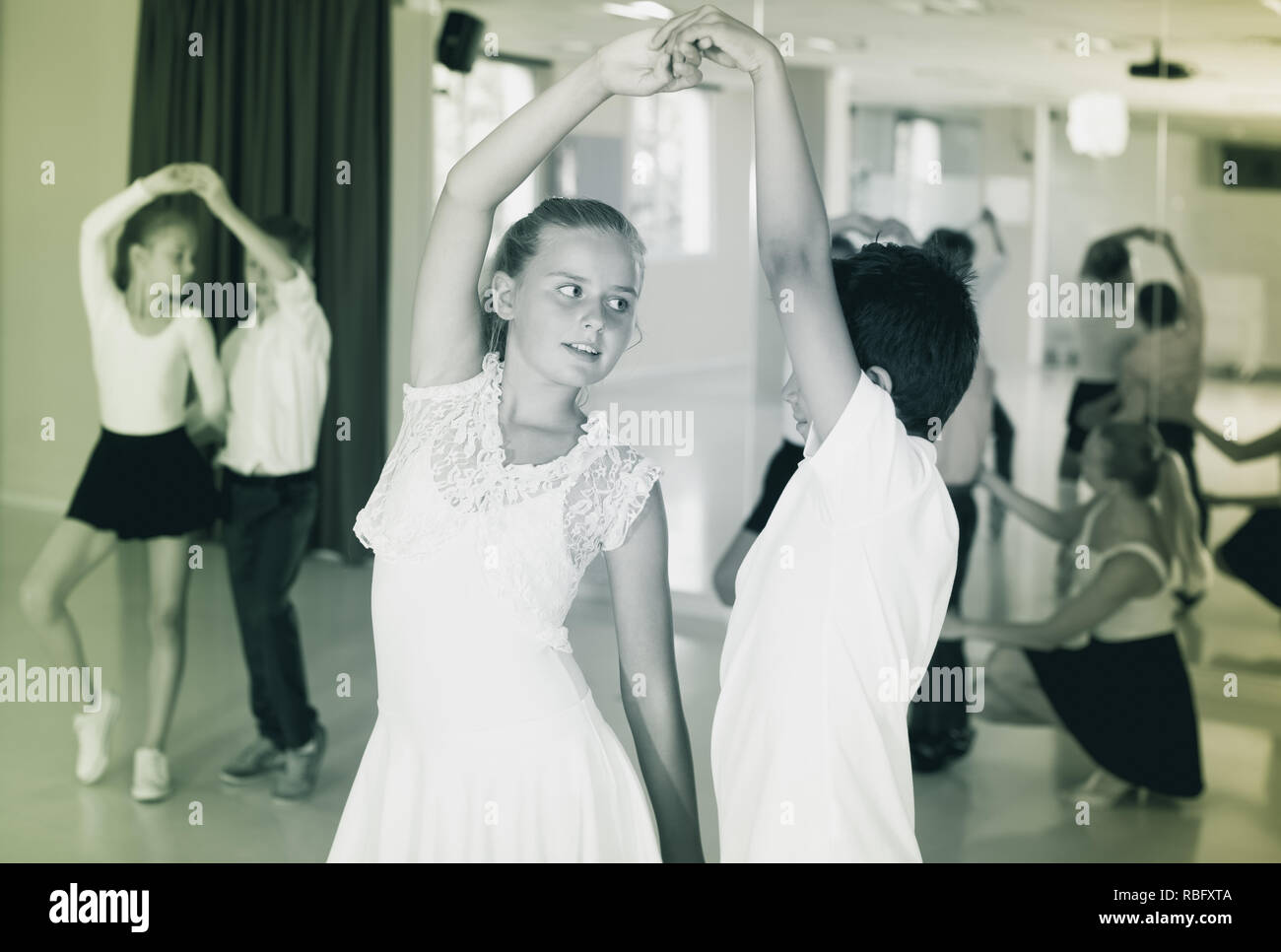 Positive children studying of partner dance at dance classes Stock ...