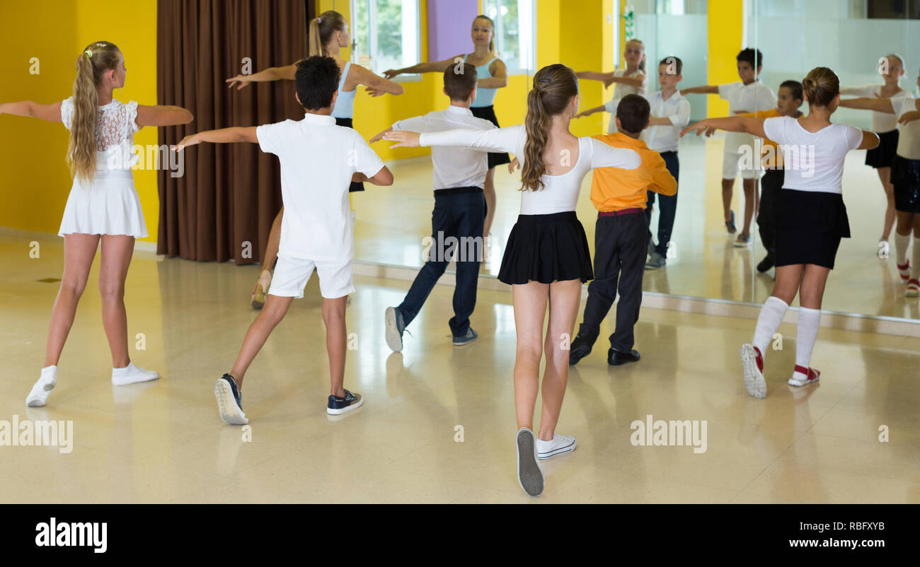 positive children learn dance movements in dance class Stock Photo - Alamy