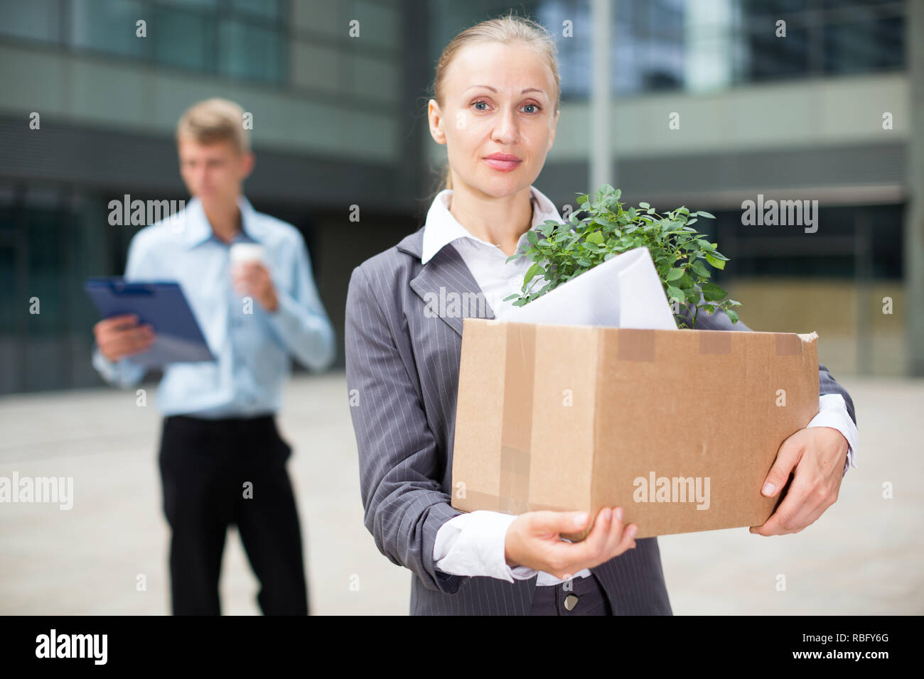 Businesswoman is standing happy near office because she leave bad job ...