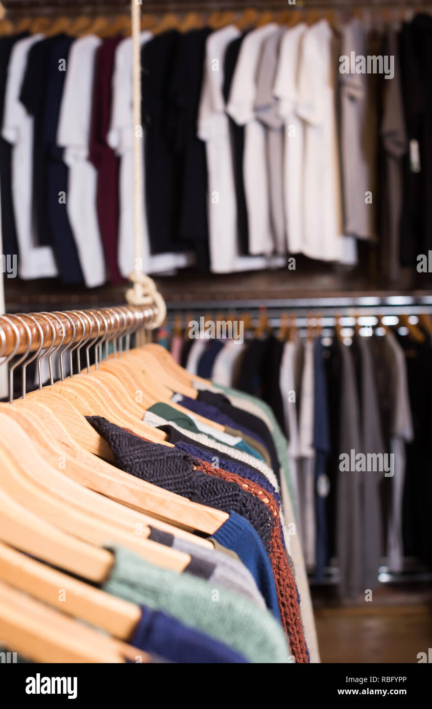 image of different colored clothes in the modern showroom Stock Photo ...