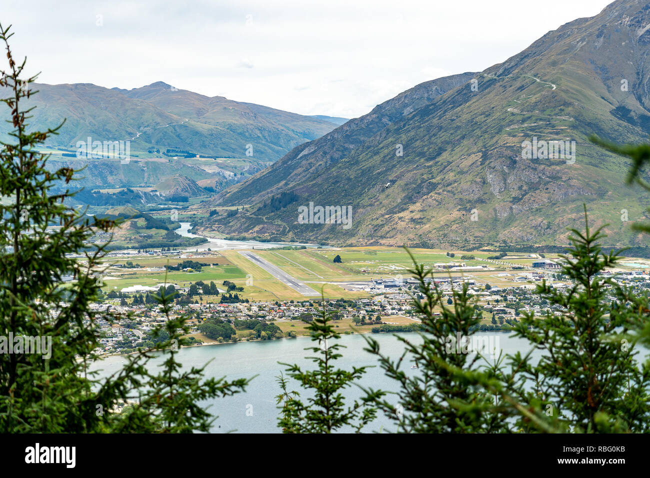 Plane taking off at Queenstown airport, New Zealand Stock Photo - Alamy