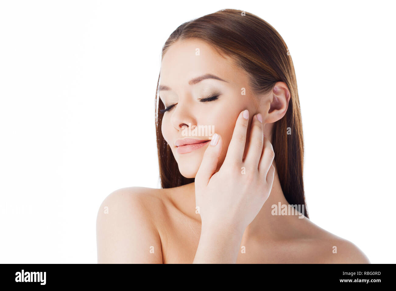 Massage your face. Use face cream and serum. Portrait of young ...