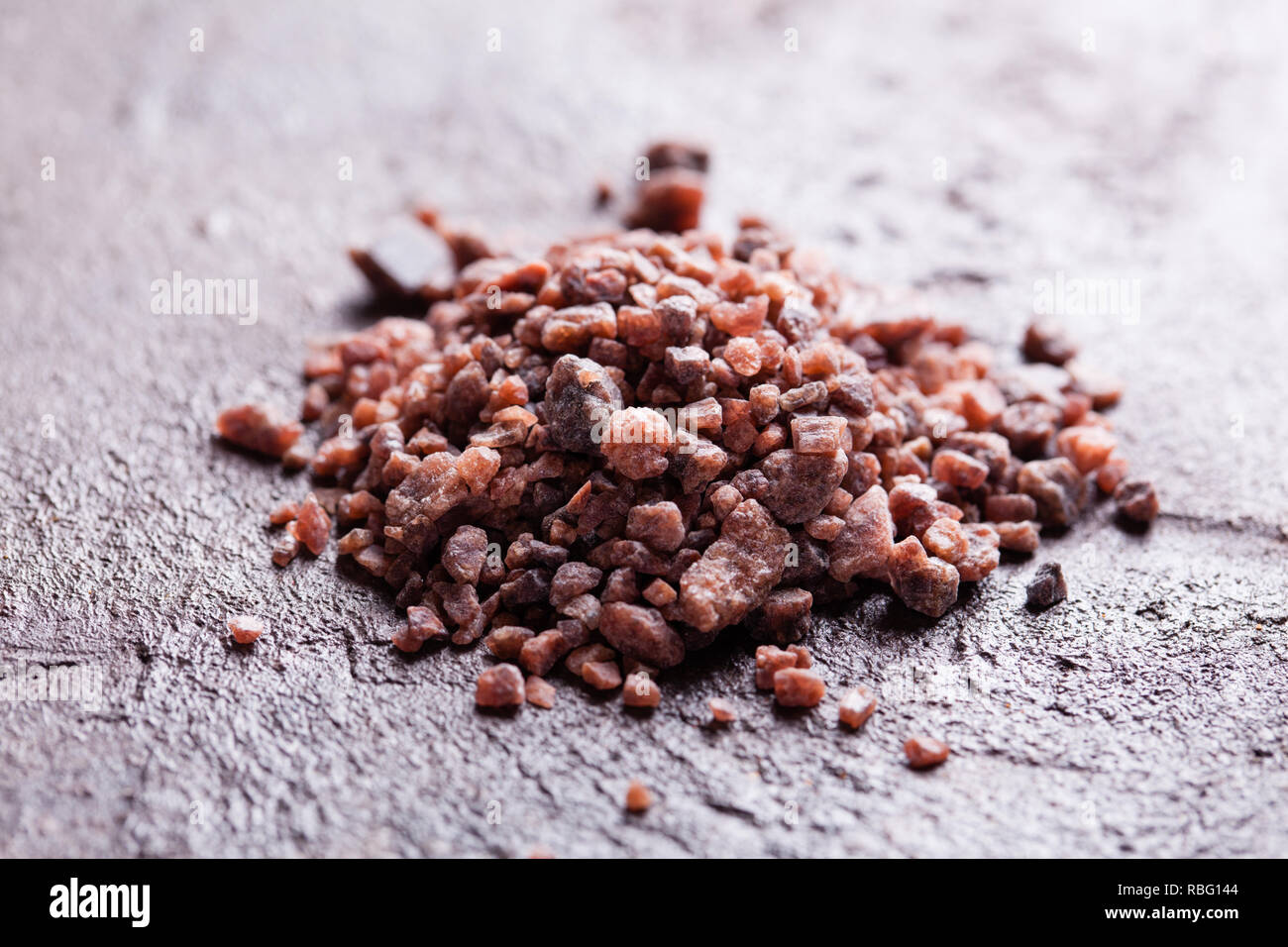 Black salt s a type of rock salt on slate background Stock Photo - Alamy