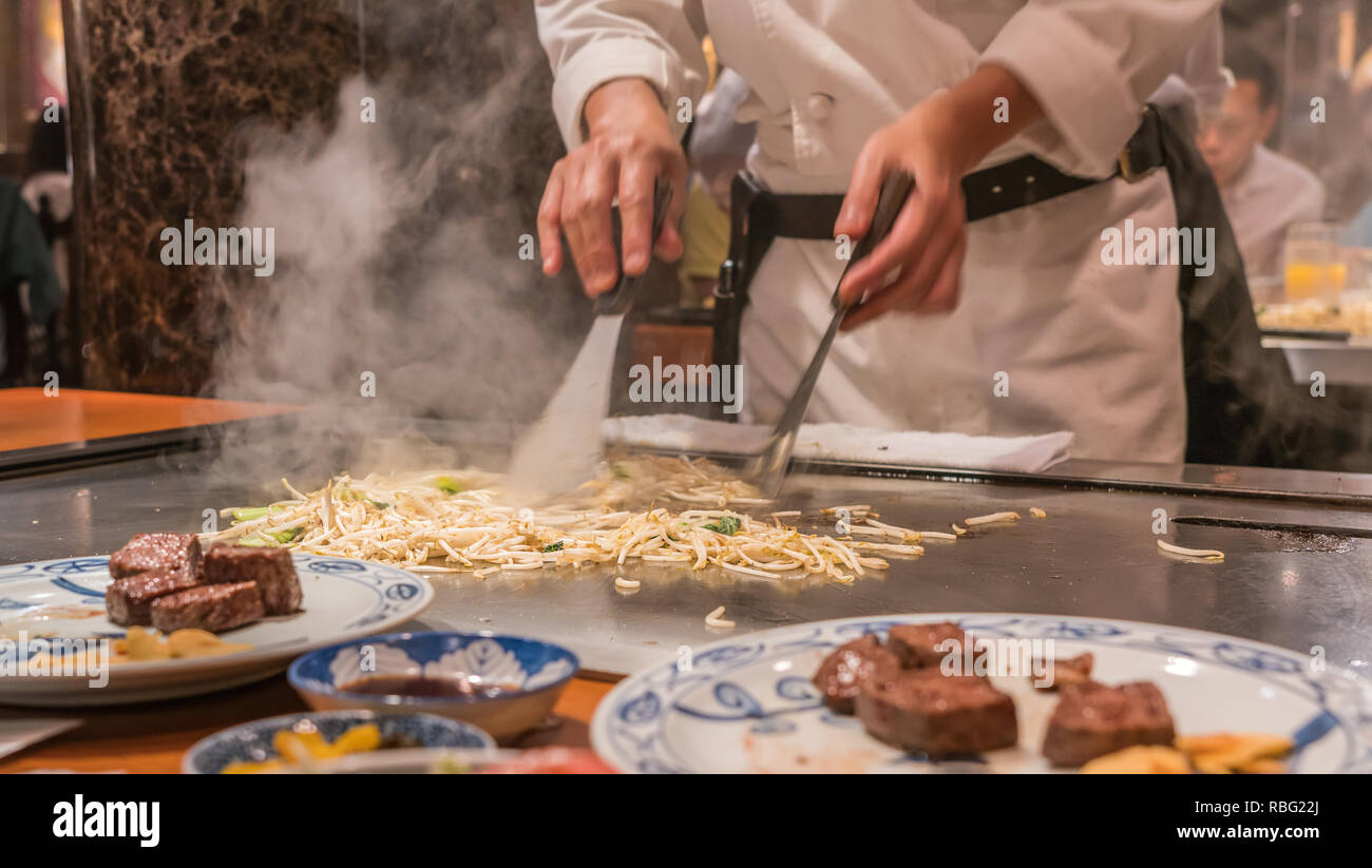 Cooking vegetables on a hot grill in Japanese steakhouse Stock Photo ...