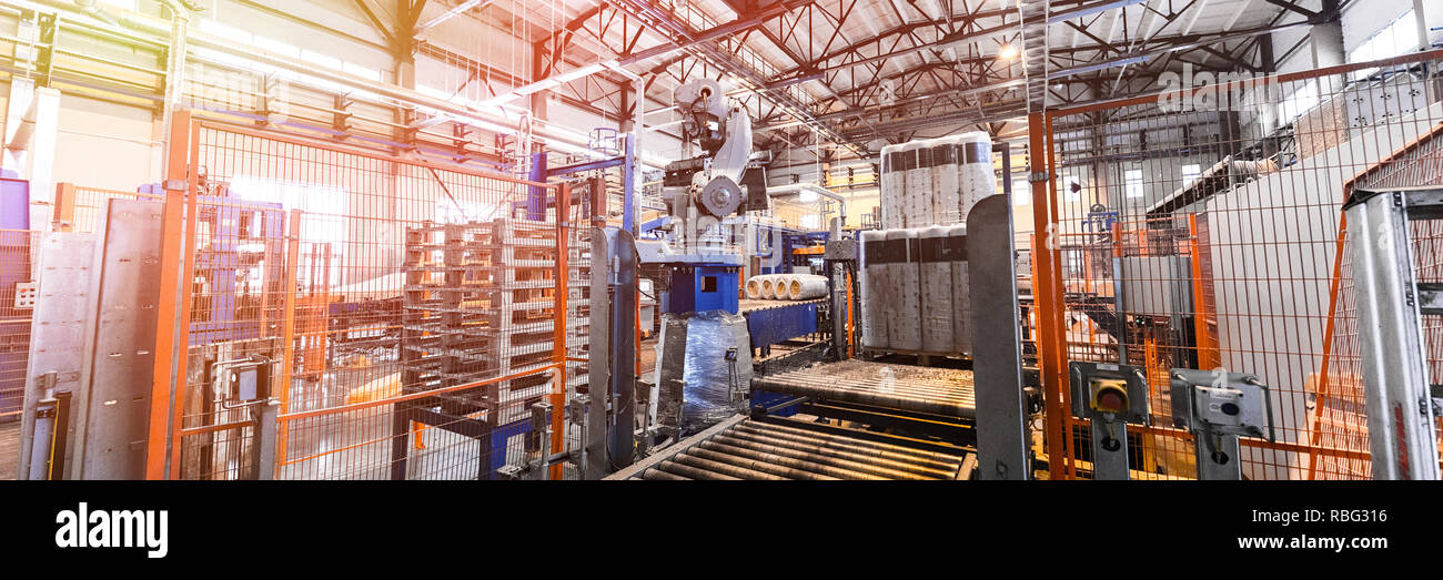 Fiberglass production industry equipment at manufacture background ...