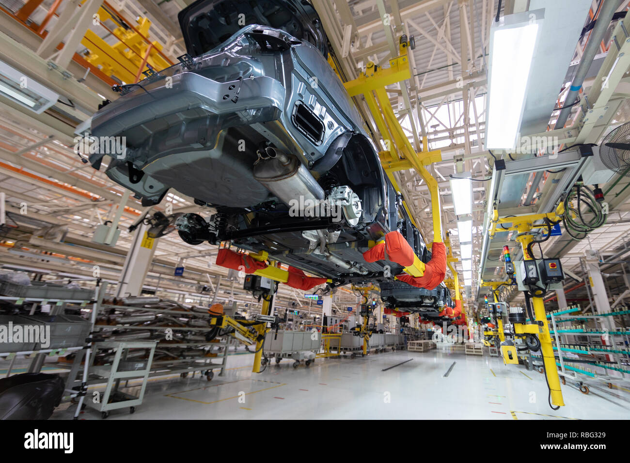 transfer of car body bottom view. Robotic equipment makes the Assembly ...