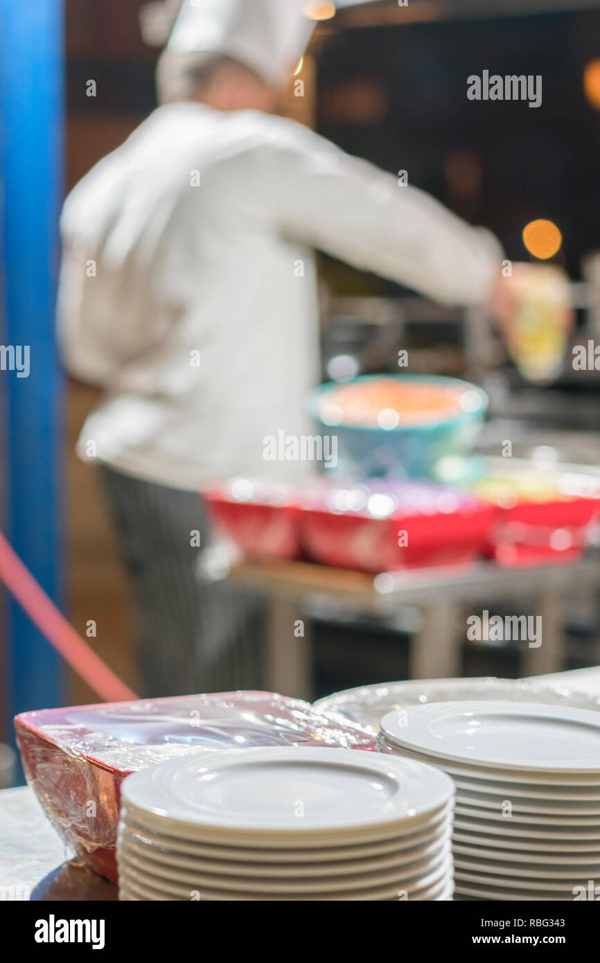 Cook in the kitchen. selected focus. vertical photo Stock Photo - Alamy
