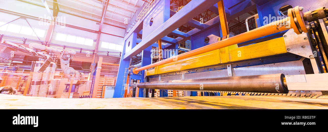 Fiberglass production industry equipment at manufacture background ...