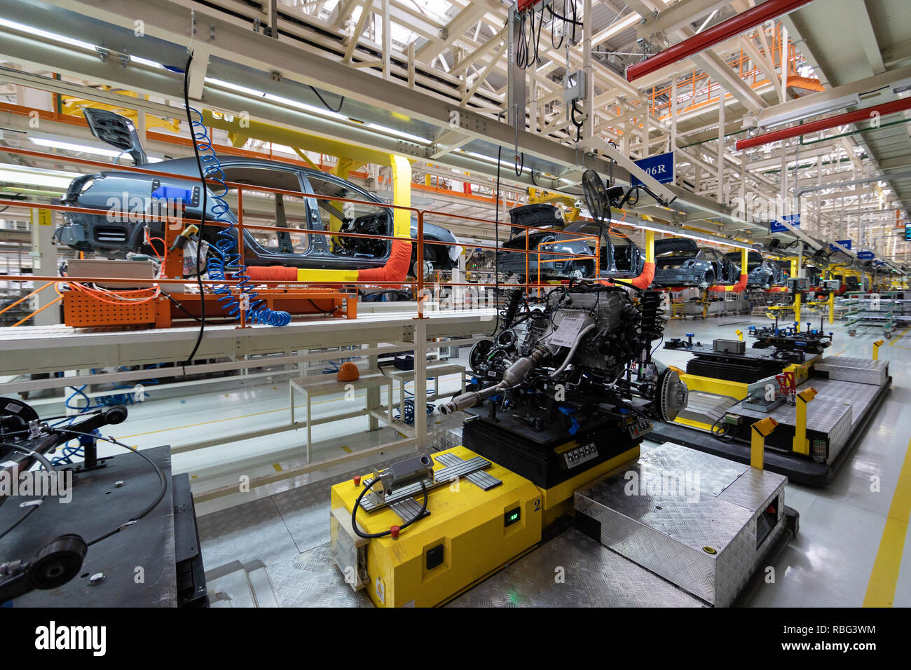 Transfer of car body. Robotic equipment makes Assembly of tcar. Modern ...