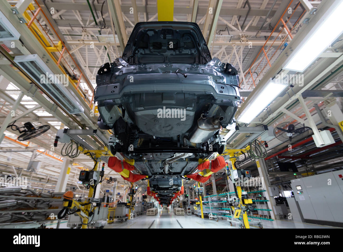 transfer of car body bottom view. Robotic equipment makes the Assembly ...