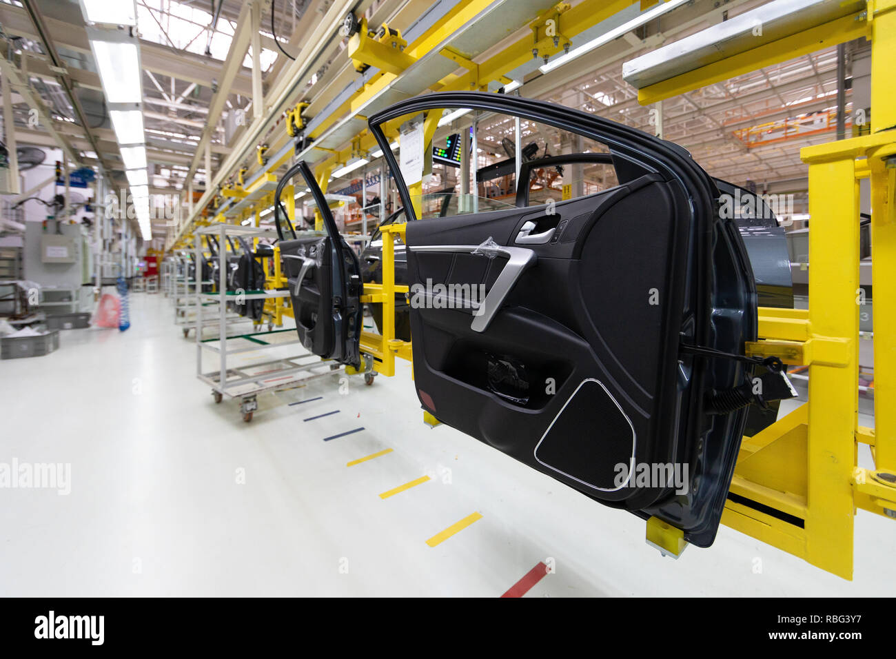 car door on conveyor. Robotic equipment makes Assembly of car. Modern ...