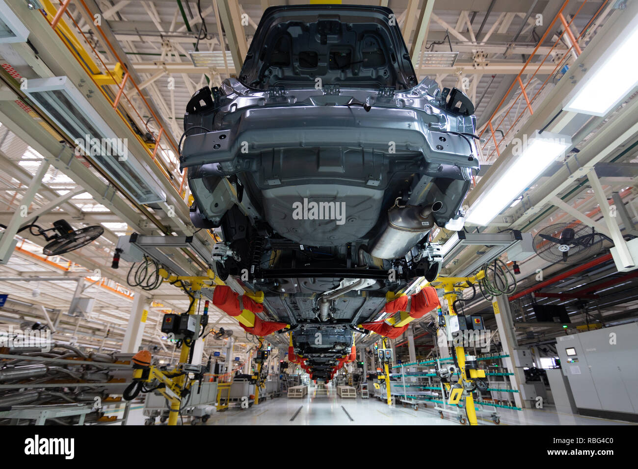 transfer of car body bottom view. Robotic equipment makes the Assembly ...