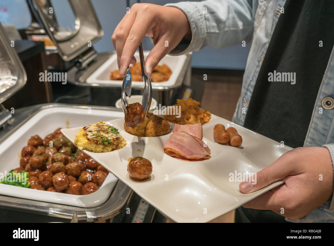 Person taking food buffet table hi-res stock photography and images - Alamy