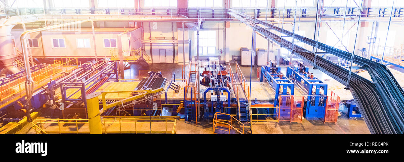 Fiberglass production industry equipment at manufacture background ...