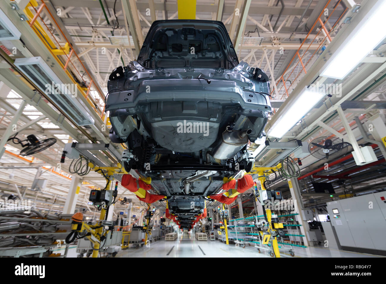 transfer of car body bottom view. Robotic equipment makes the Assembly ...