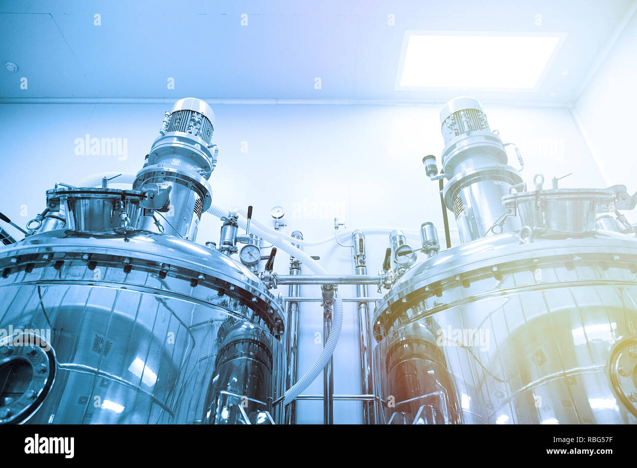 big steel tanks in laboratory. Blue tone. Blue tint Stock Photo - Alamy