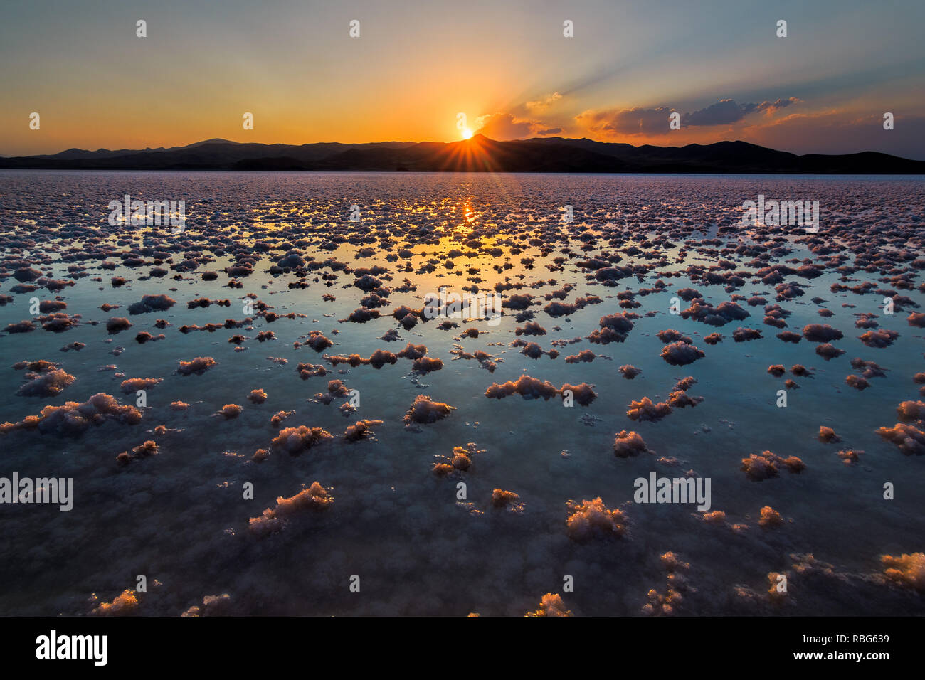 Sunset on the salt flat of Urmia lake, West Azerbaijan province, Iran ...