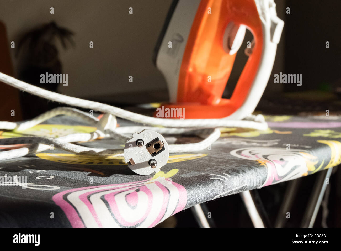 White iron plug against the backdrop of the iron in the house Stock ...