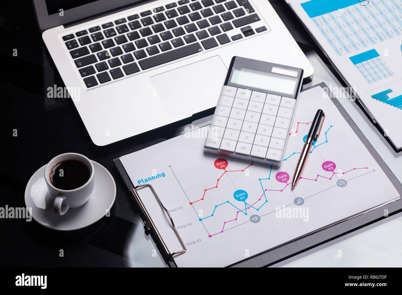 Modern calculator is on the notebook and on the sheet with the schedule ...