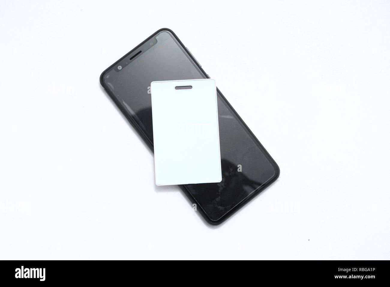 Picture of tag card and smartphone. Isolated on the white background ...