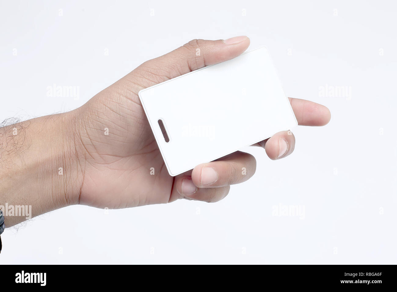 Boy is holding tag card in hand. Isolated on the white background Stock ...