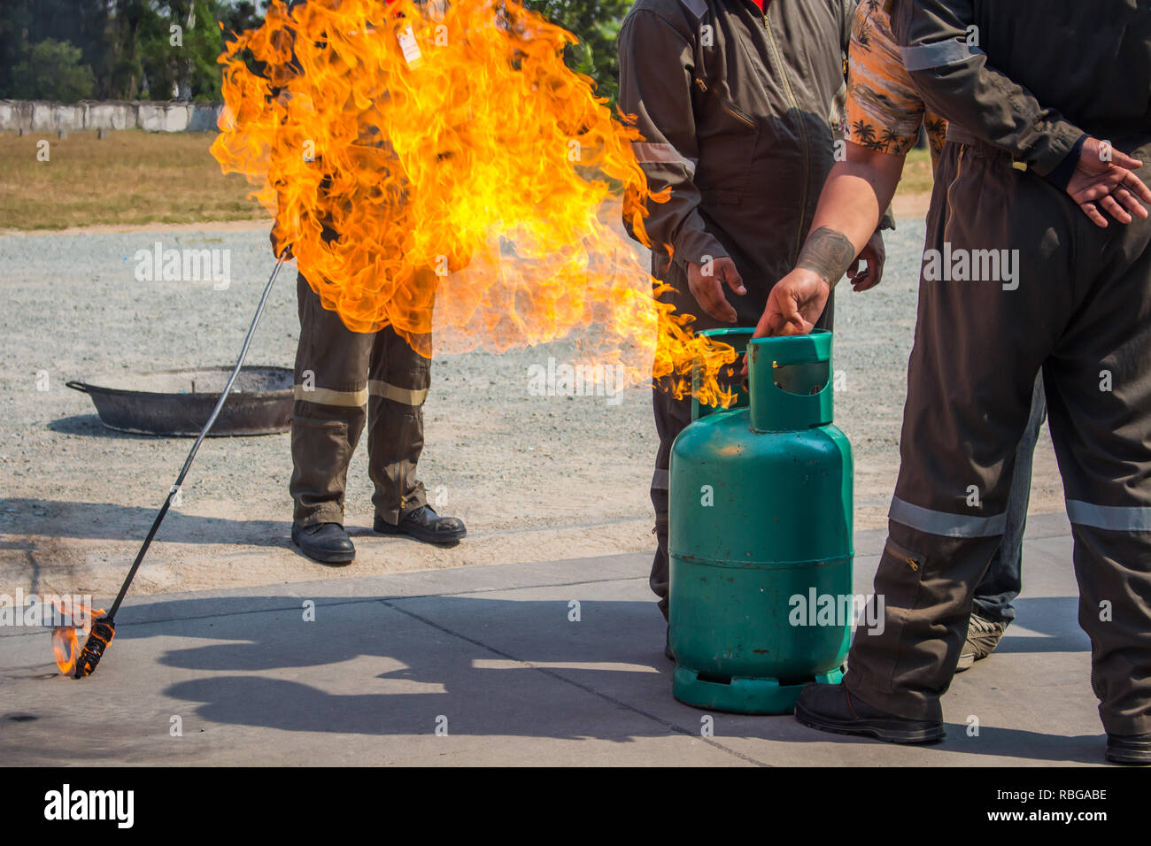 Training on how to extinguish a fire, burning a gas tank Stock Photo ...