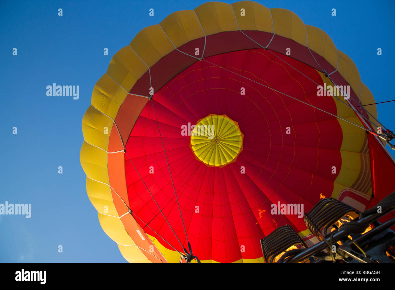 Colorful hot-air balloon in the sky with open fire Stock Photo - Alamy