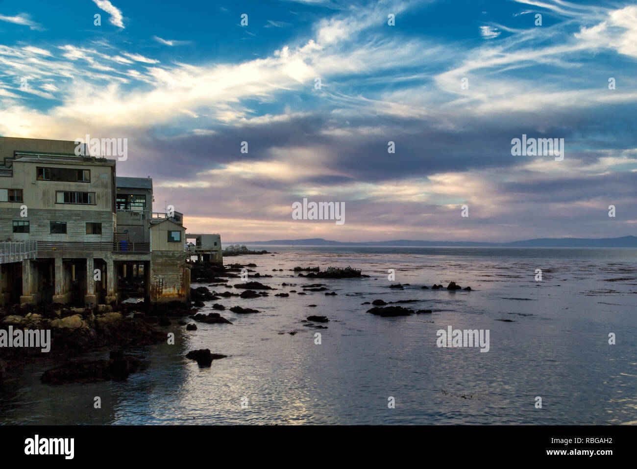 Beautiful sunset and old coastal buildings in Monterey, California ...