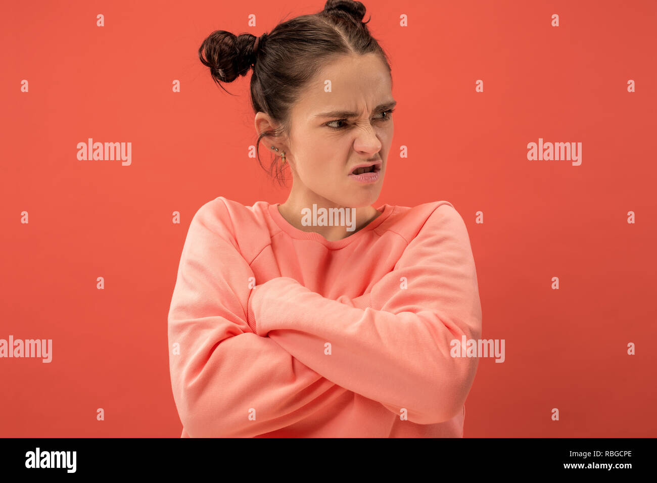 Angry woman looking at camera. Aggressive business woman standing ...