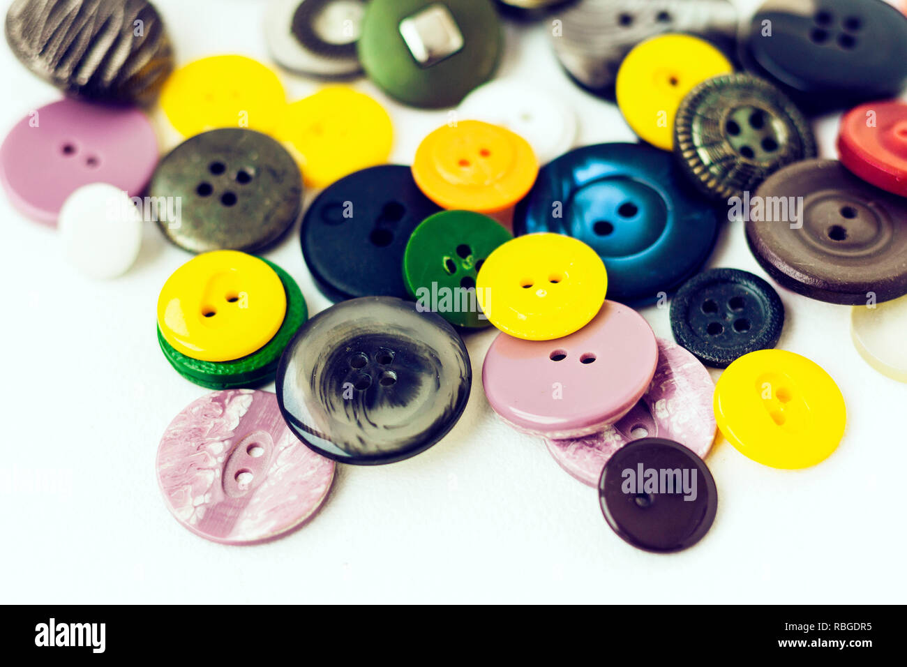 Colorful sewing buttons on white background closeup Stock Photo - Alamy
