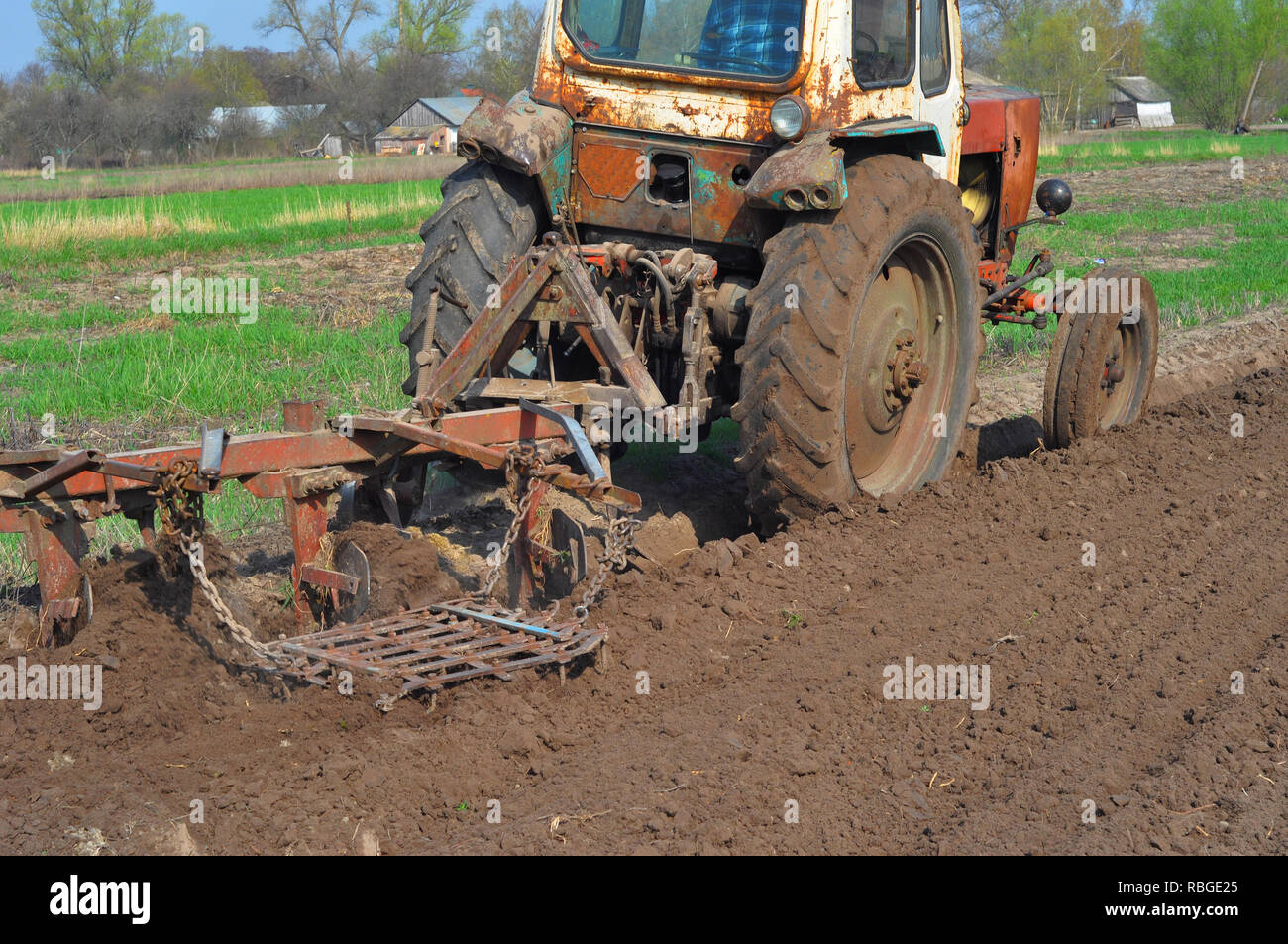 Old tractor ploughing field hi-res stock photography and images - Alamy