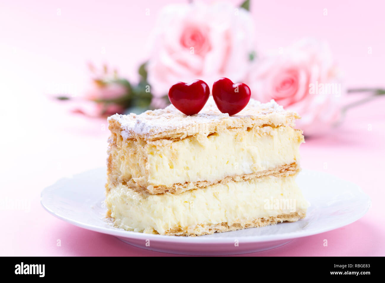 French Mille feuille cake with vanilla cream decorated with hearts on a ...