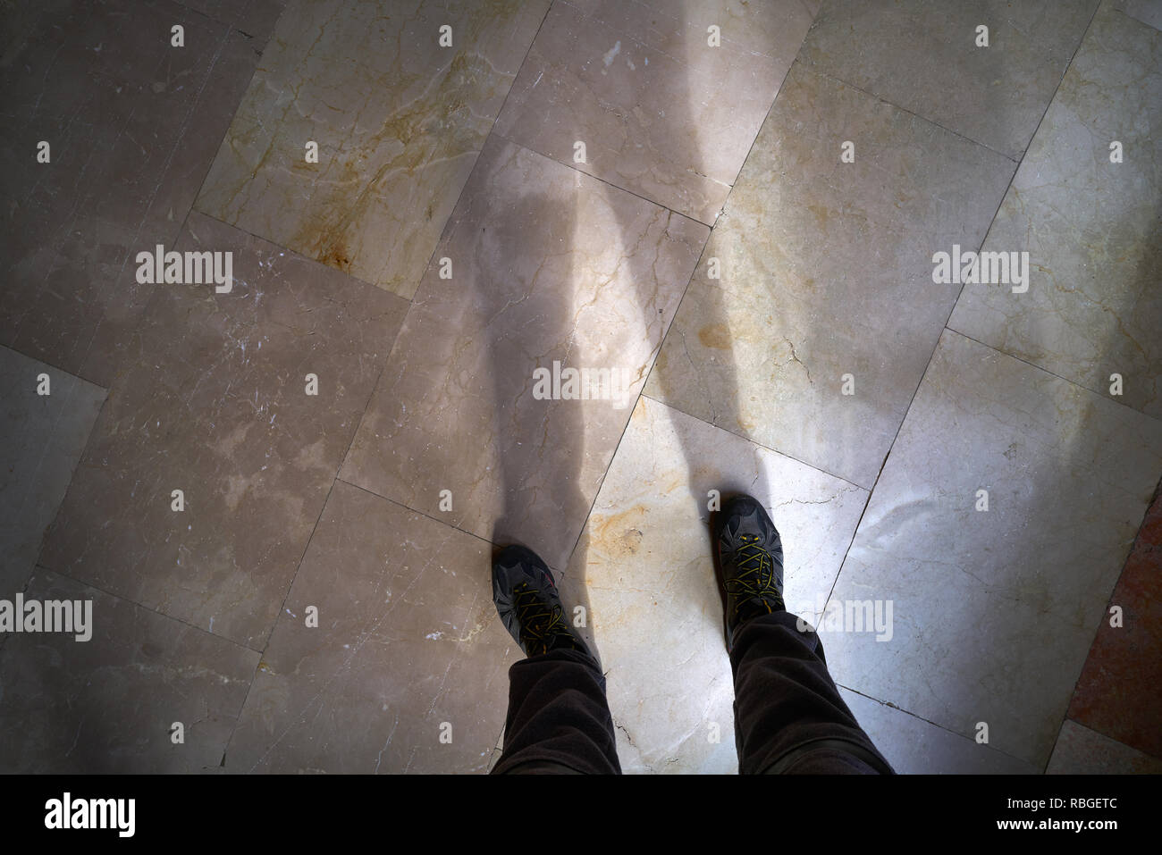 Legs and feet shoes shadow on marble floor flooring background Stock ...