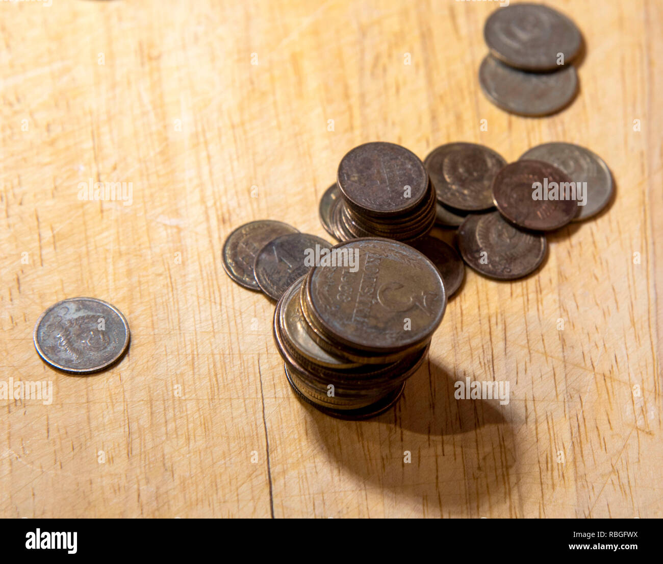 Stacks of coins and a vintage brick wall reverse Stock Photo - Alamy