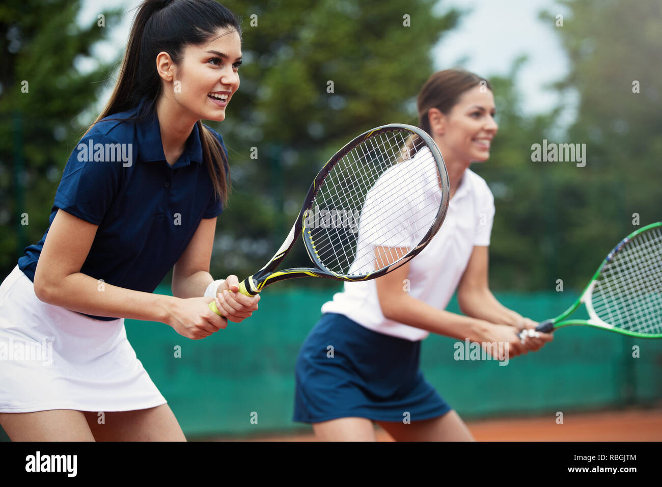 Group of healthy happy friends at the club playing tennis Stock Photo ...