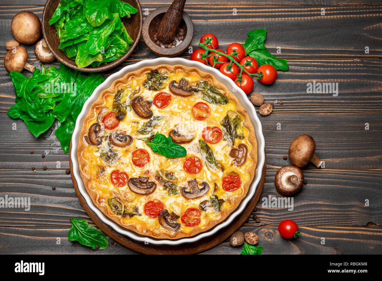 Baked homemade quiche pie in ceramic baking form Stock Photo - Alamy