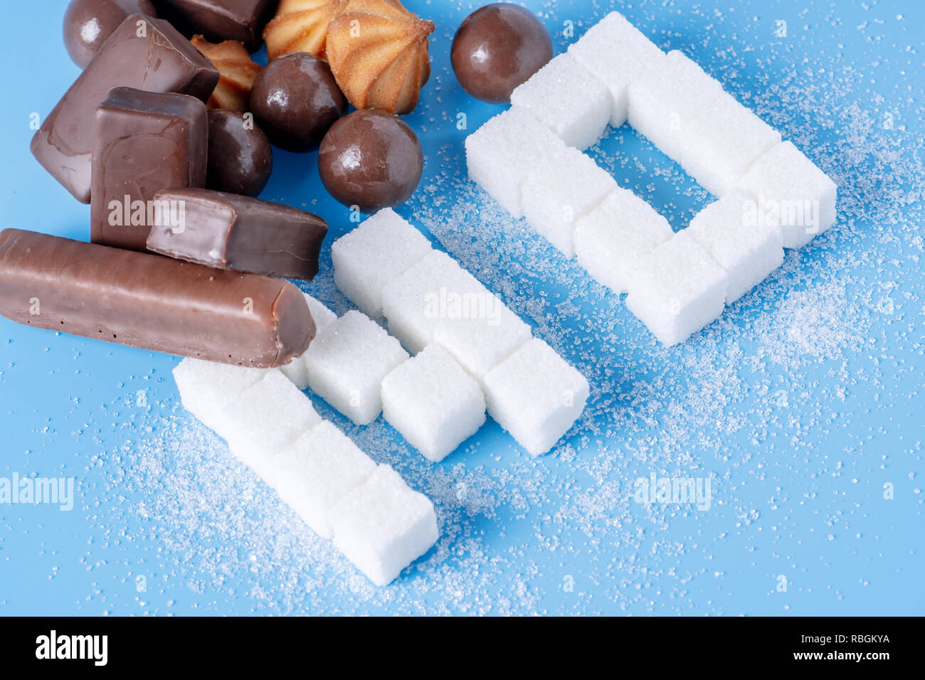 Text No is lined with sugar cubes with sweets and cookies. The concept ...