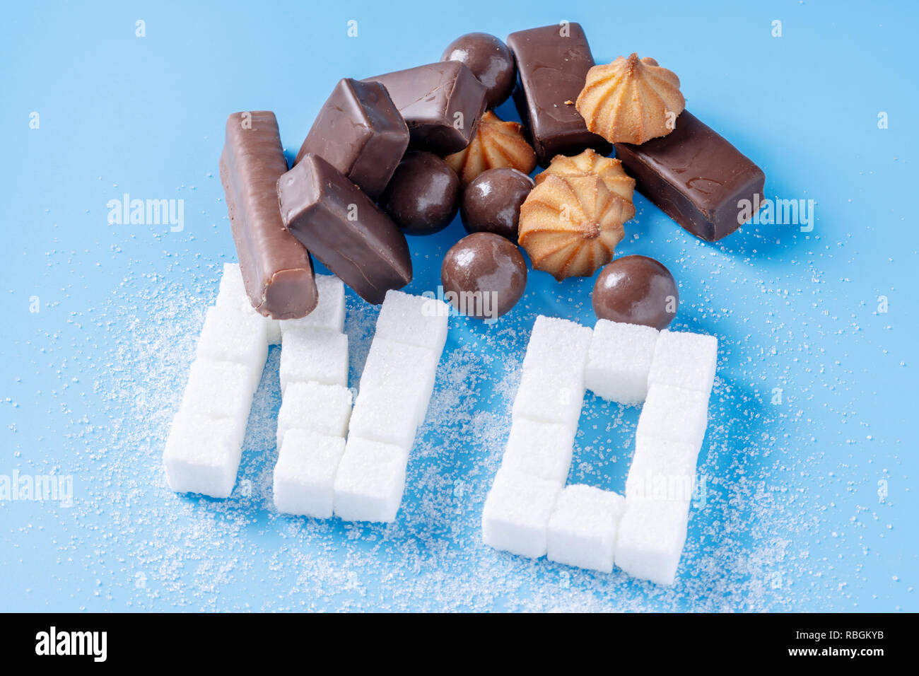 Text No is lined with sugar cubes with sweets and cookies. The concept ...