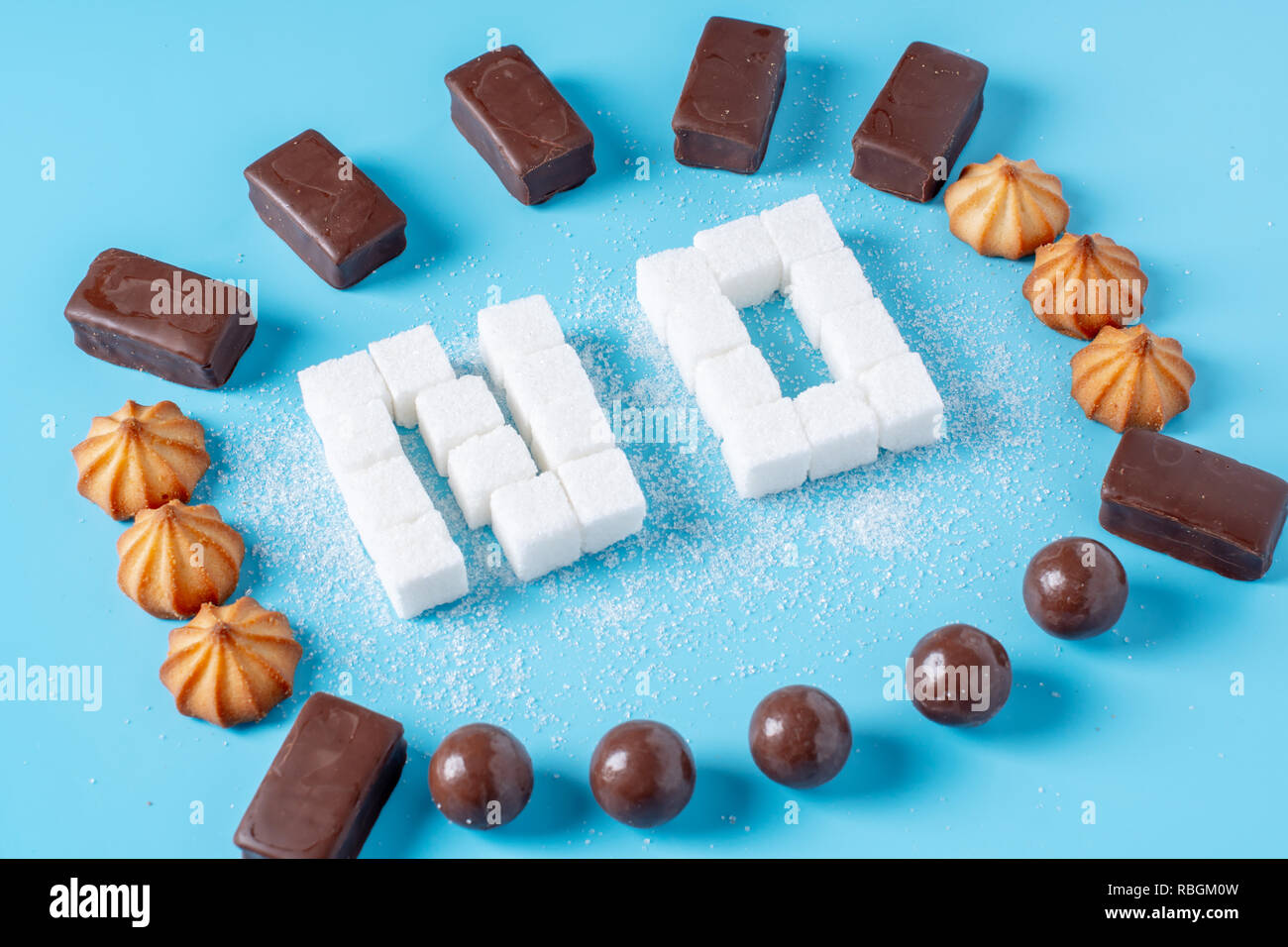 Text No is lined with sugar cubes with sweets and cookies. The concept ...
