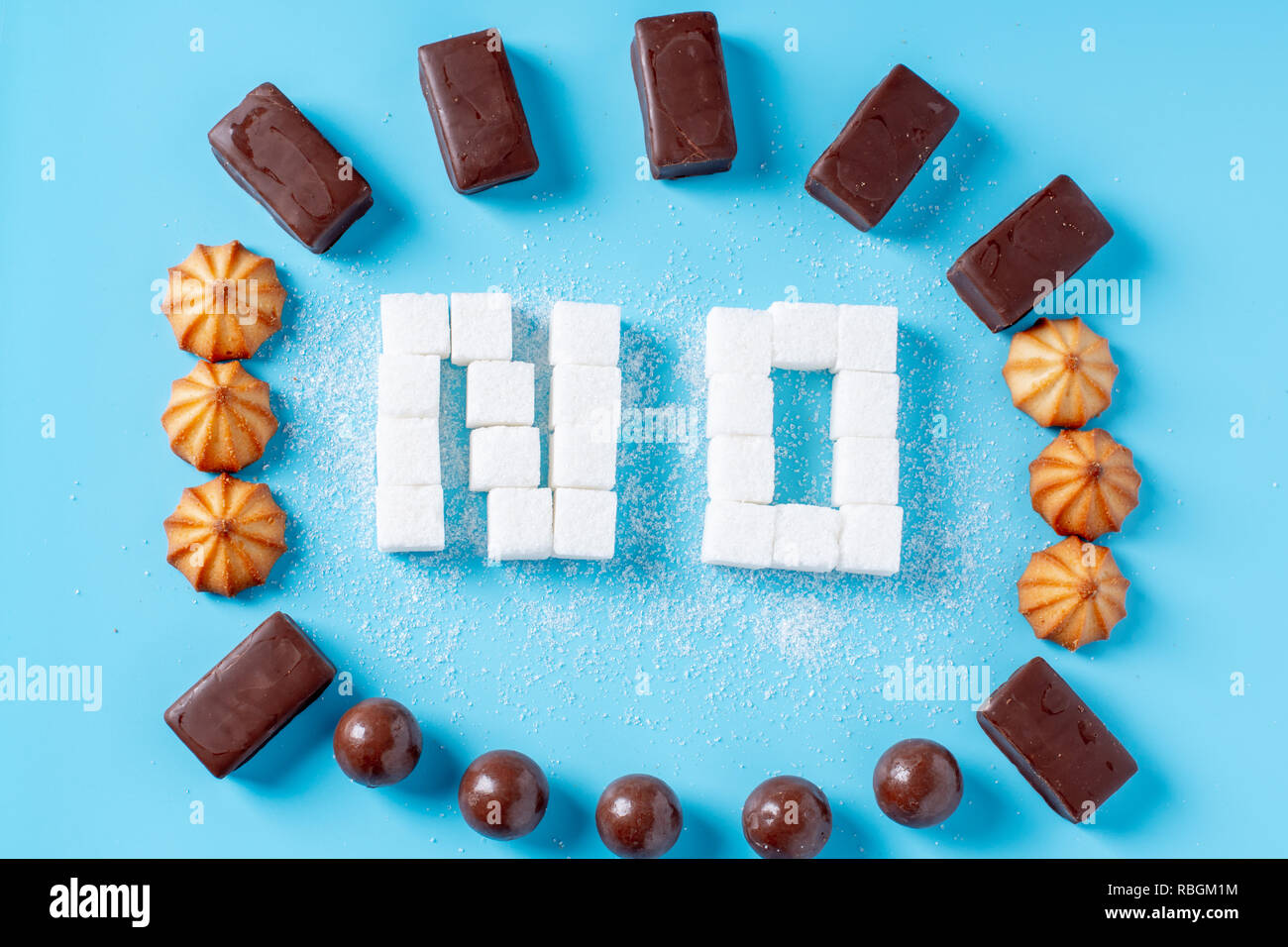 Text No is lined with sugar cubes with sweets and cookies. The concept ...
